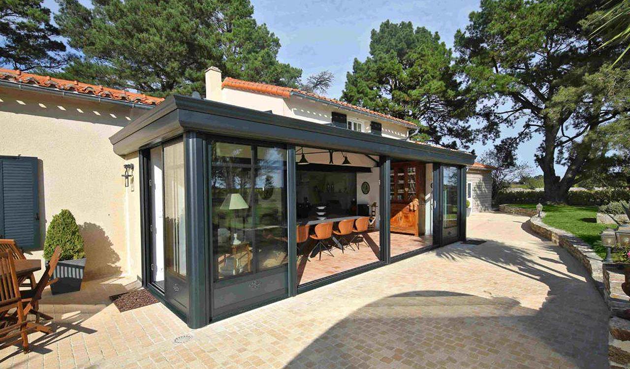 Veranda avec mur plein : Quels matériaux choisir ? - Rénoval Véranda